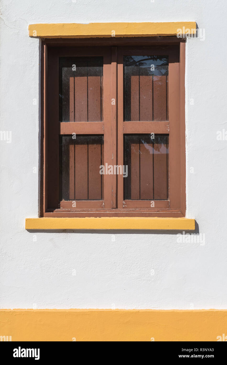 Traditional brown window on white wall Stock Photo - Alamy