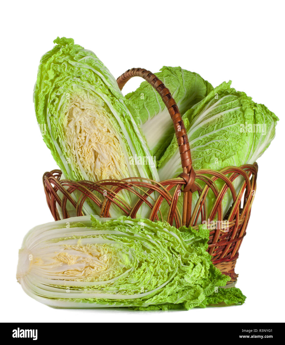 chinese cabbage and half in a wicker basket isolated on white ...