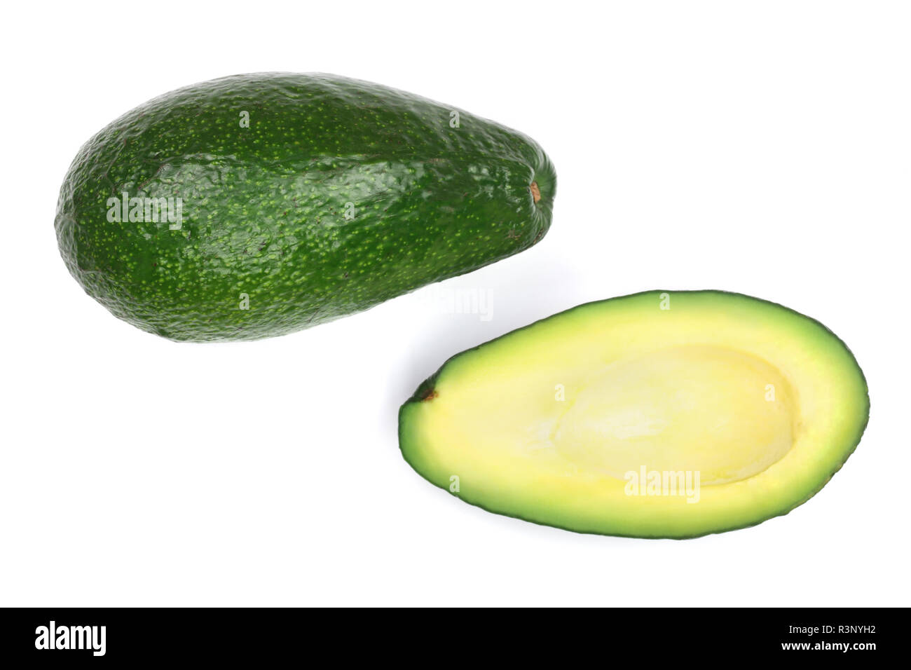 whole and half avocado isolated on white background close-up. Top view ...