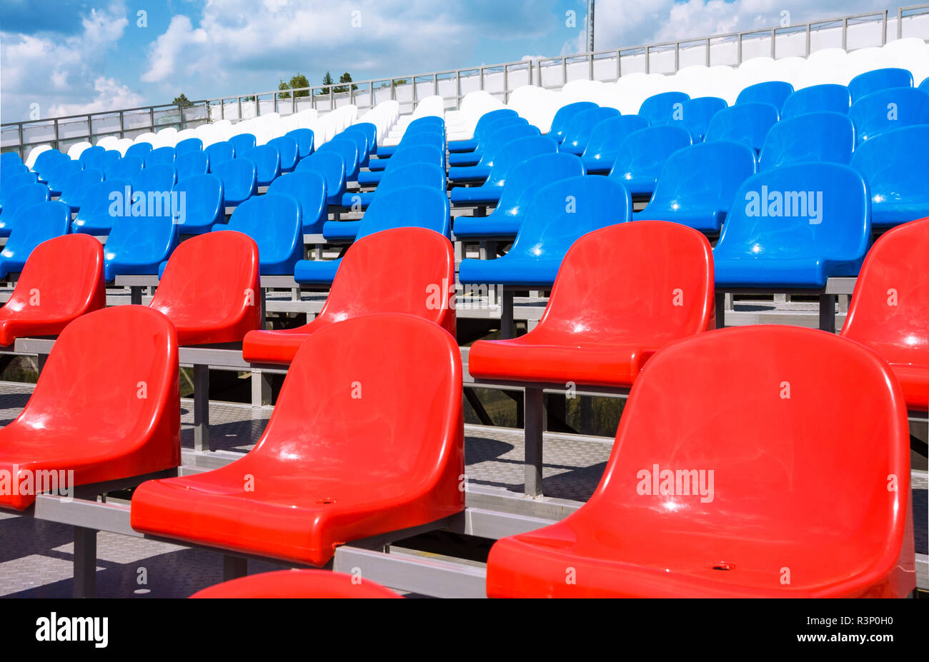 Plastic seats on stadium in summer Stock Photo - Alamy