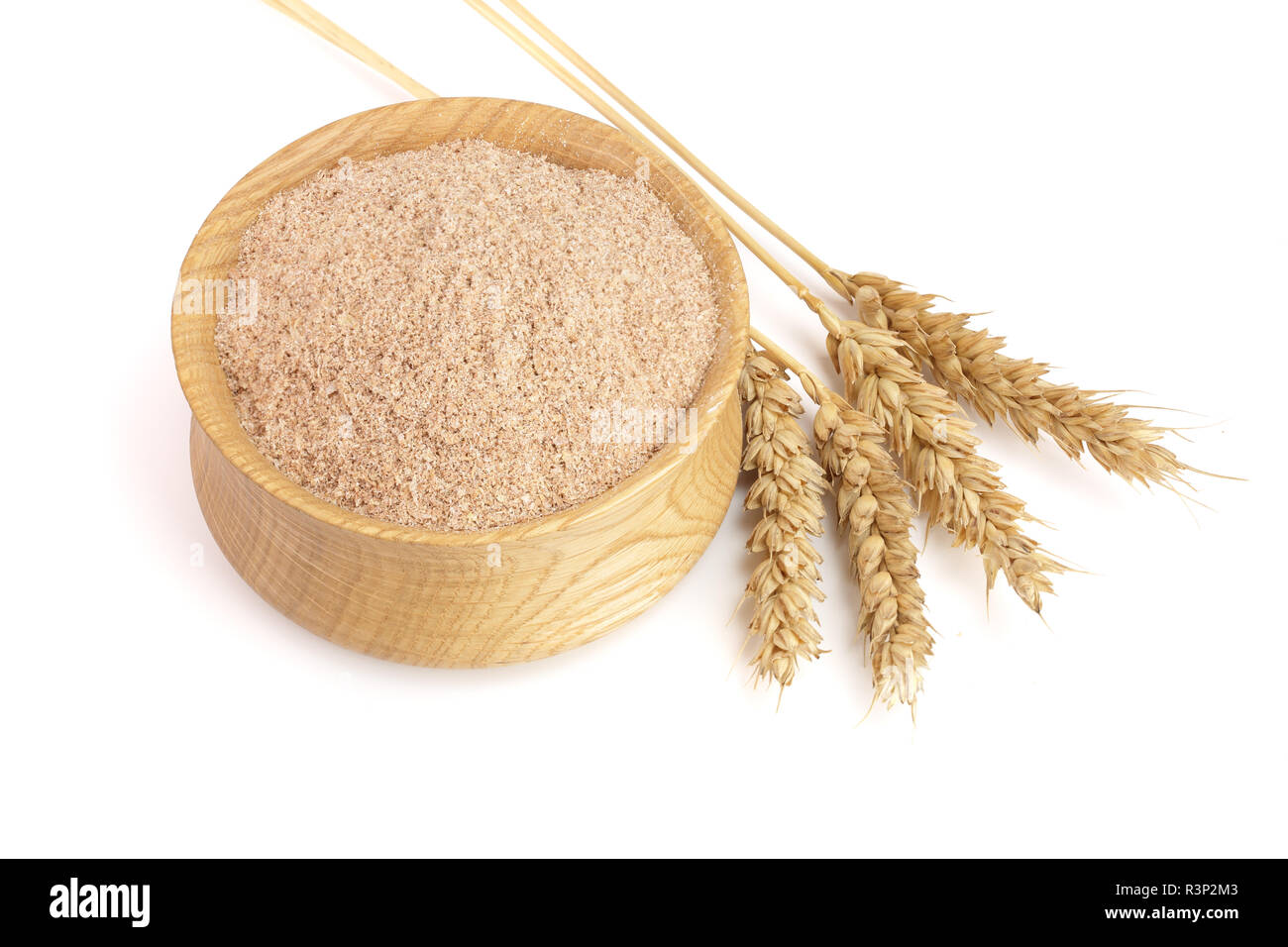 Pile of wheat bran in wooden bowl with ears isolated on white ...