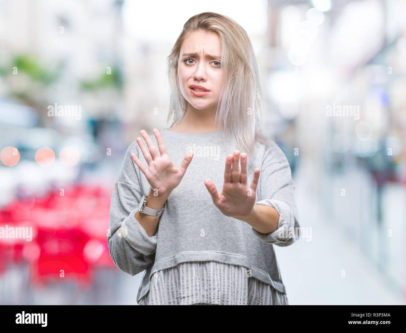 Young blonde woman over isolated background disgusted expression ...