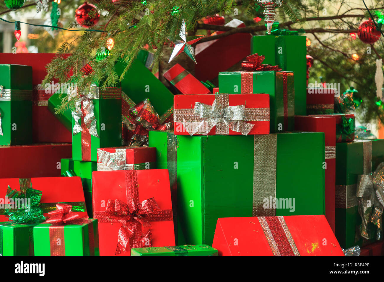 Christmas gifts under a tree Stock Photo - Alamy