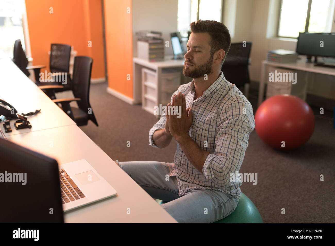 Desk yoga hi-res stock photography and images - Alamy