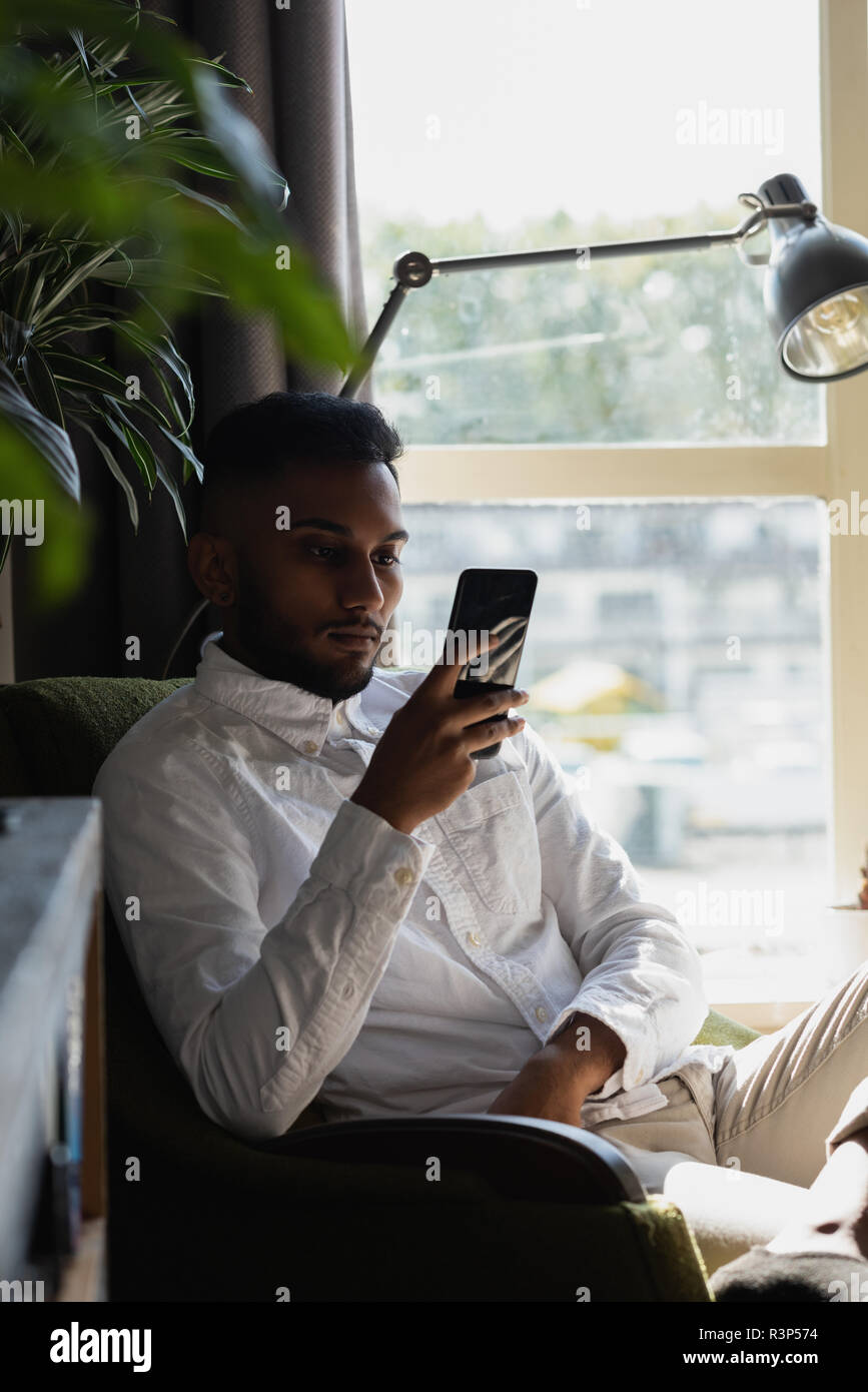 Mobile phone on arm hi-res stock photography and images - Alamy