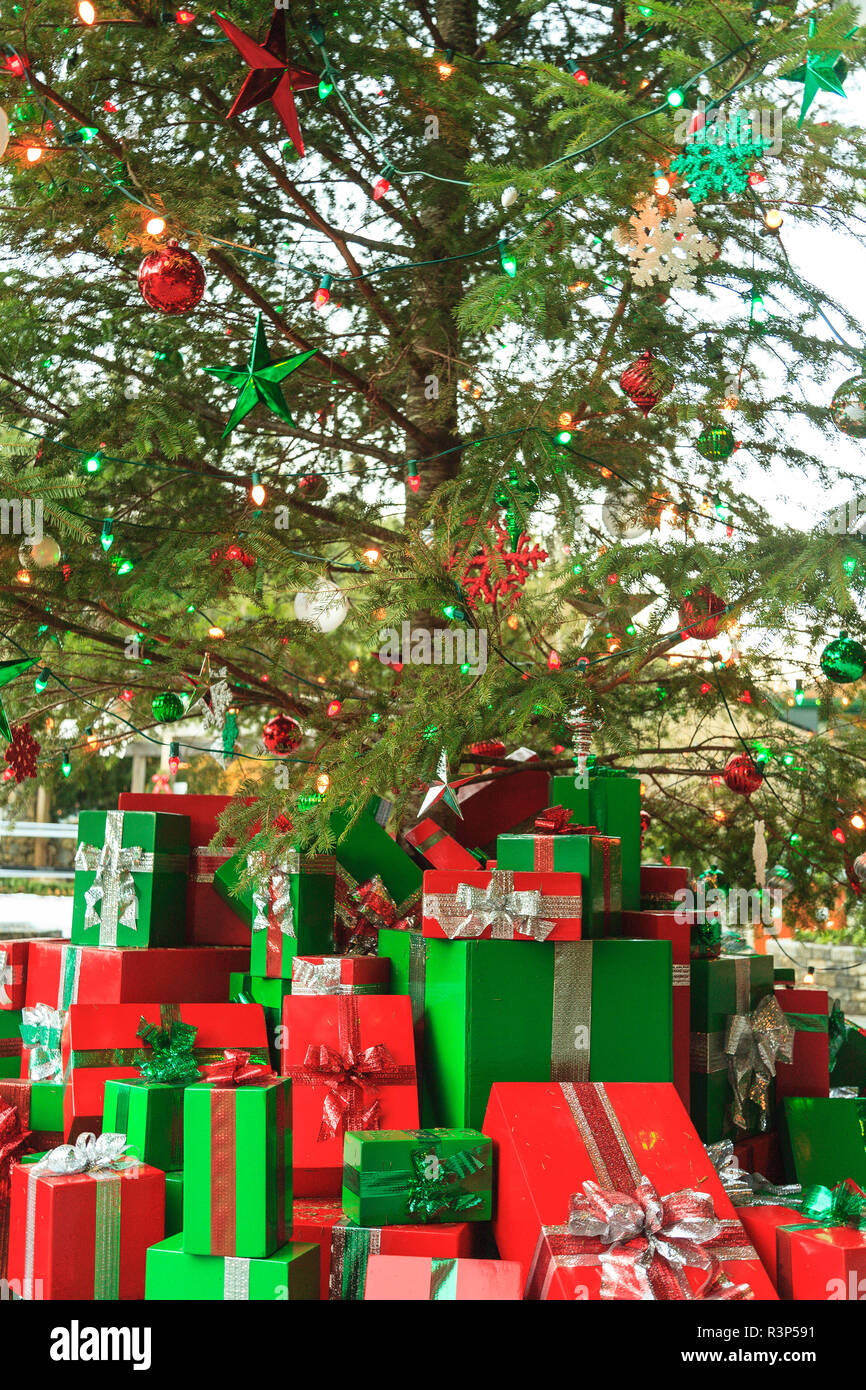 Christmas gifts under a tree Stock Photo - Alamy
