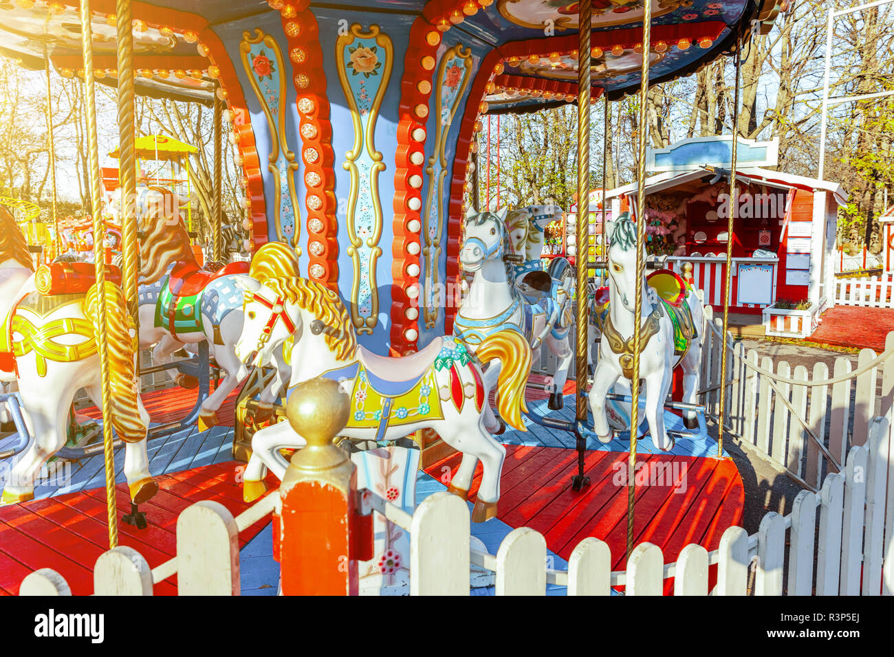 Children outdoor colourful vintage Merry-Go-Round flying horse carousel ...