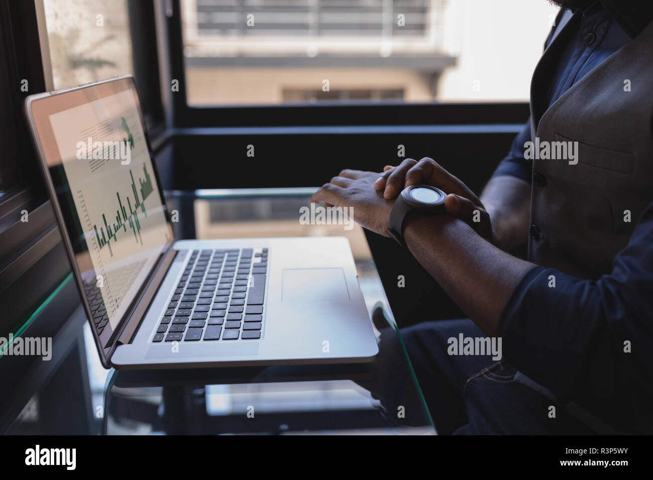 Black businessman using smartwatch office hi-res stock photography and ...