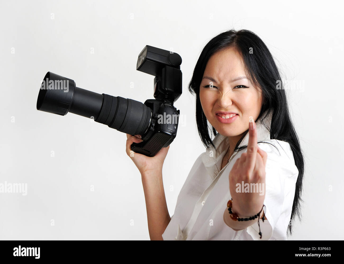 Asian woman with photo camera on white background Stock Photo - Alamy