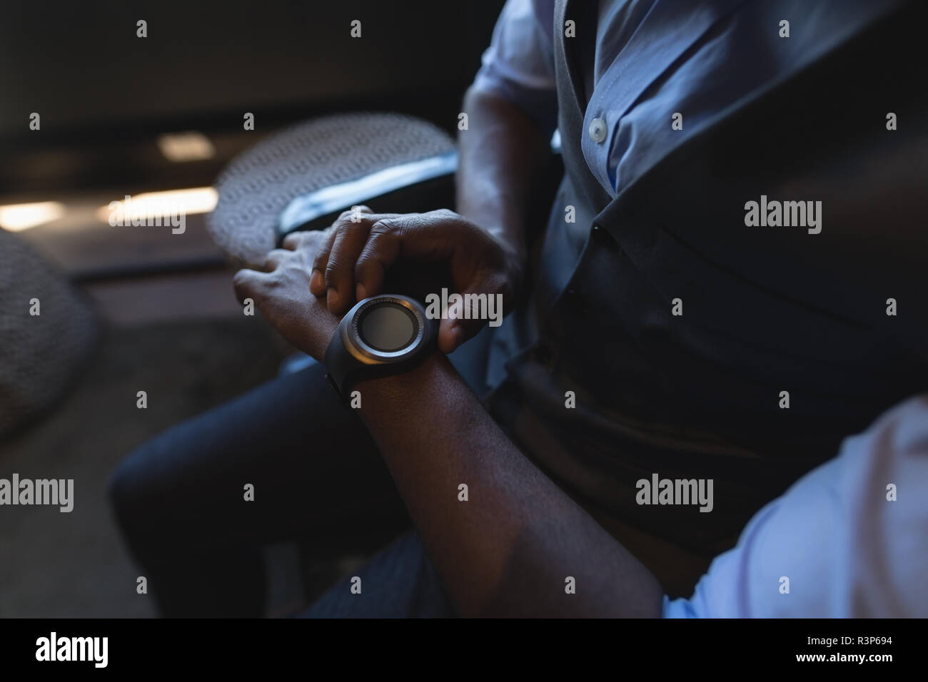 Black businessman using smartwatch office hi-res stock photography and ...