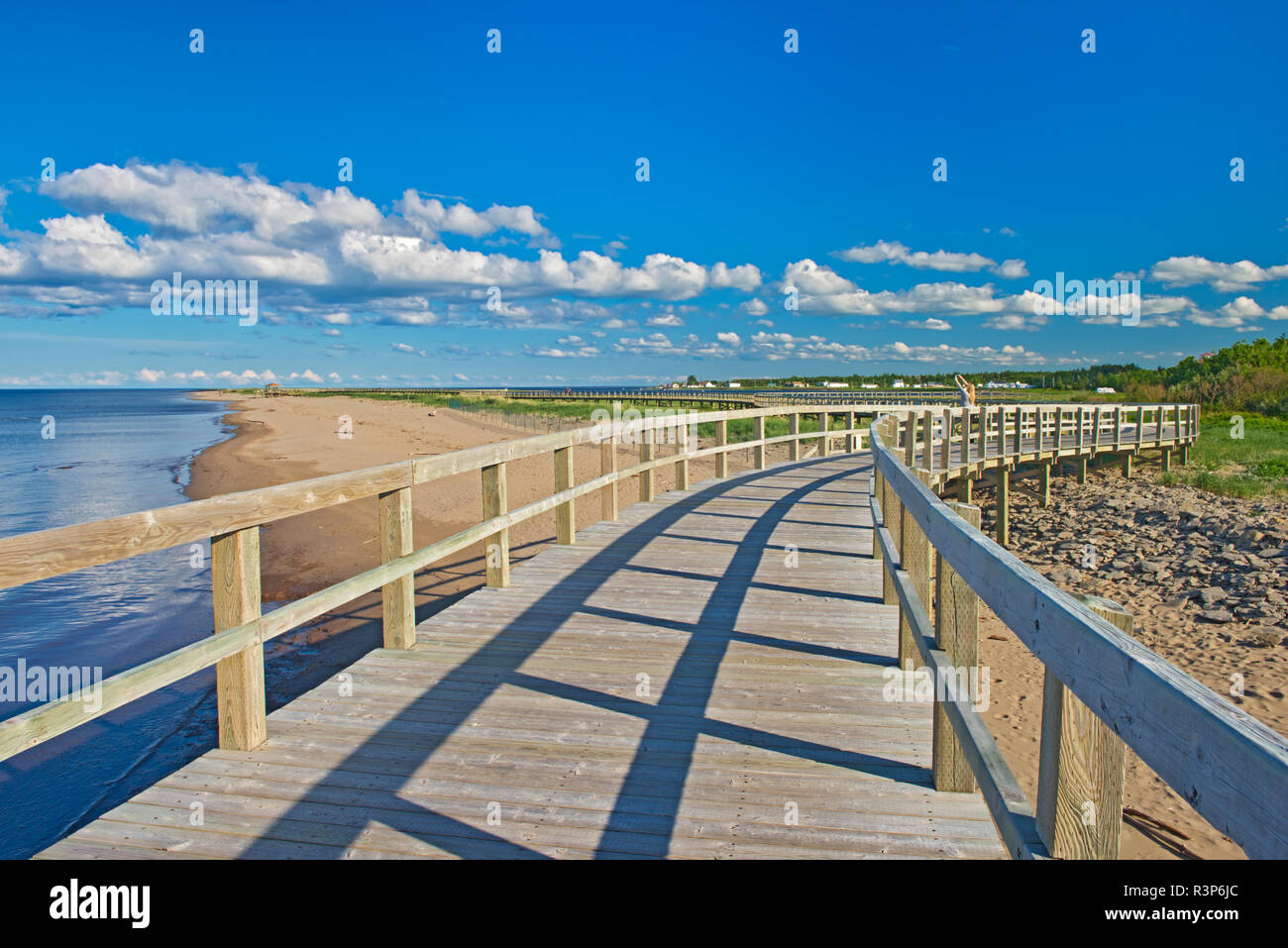 Canada, New Brunswick, Bouctouche. Boardwalk next to ocean Stock Photo ...