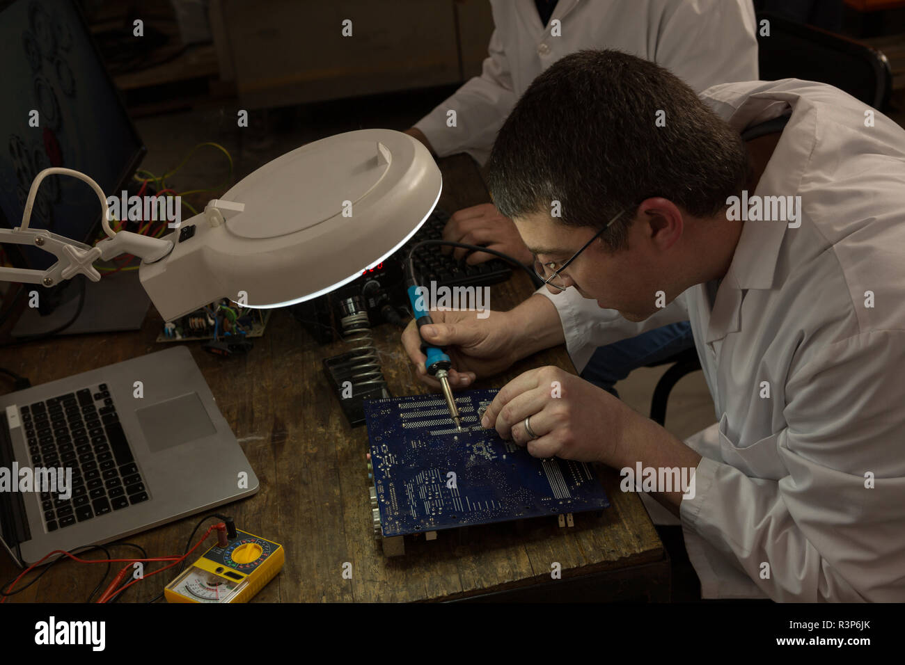 Engineer soldering circuit board hi-res stock photography and images ...