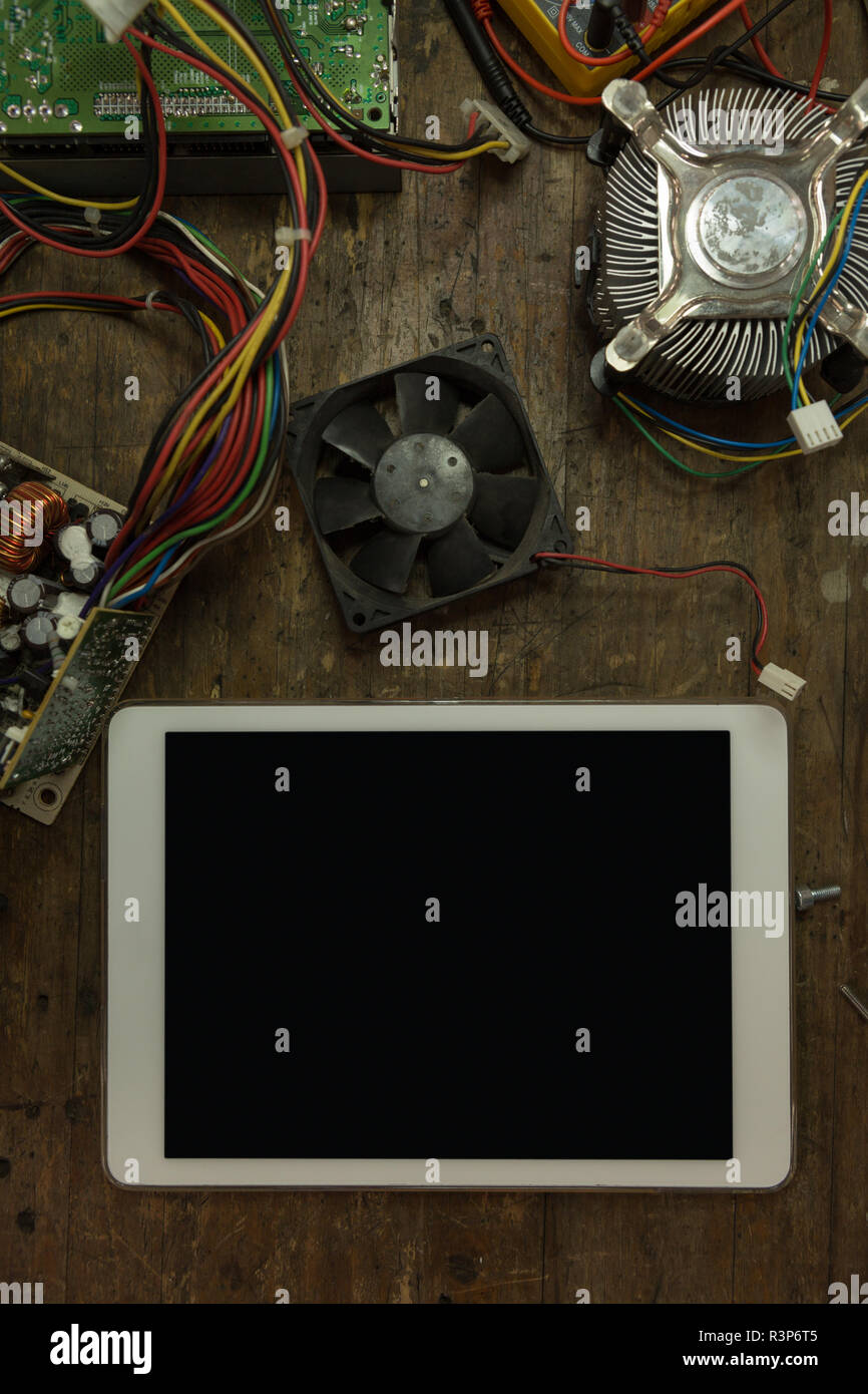 Digital tablet, circuit board and computer fan on table Stock Photo - Alamy