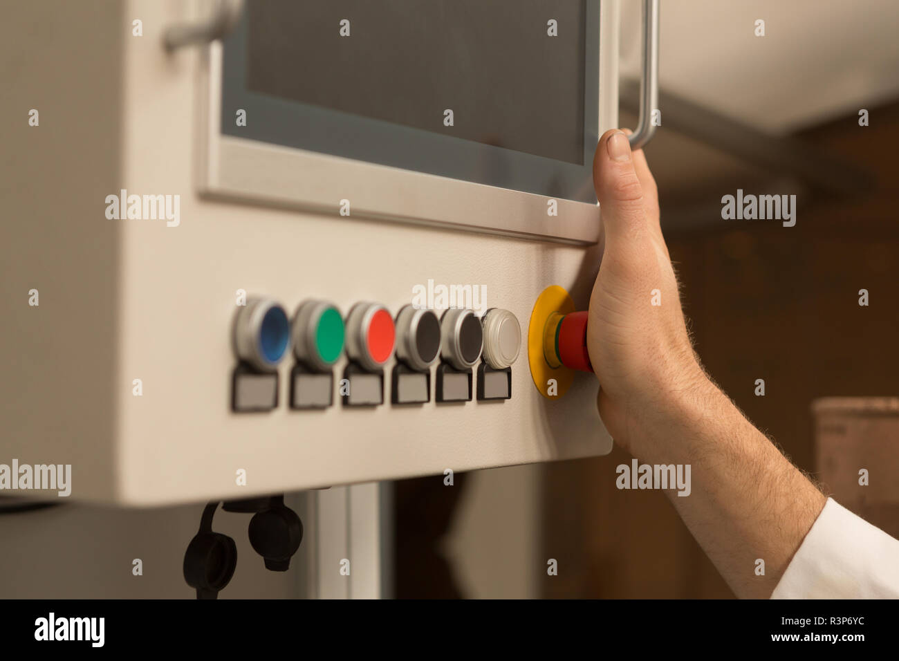Robotics engineer controlling control panel in warehouse Stock Photo ...