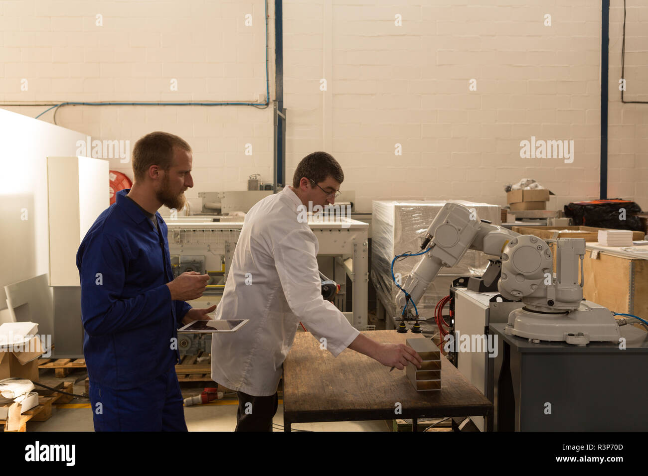 Engineer operating robotic machinery hi-res stock photography and ...