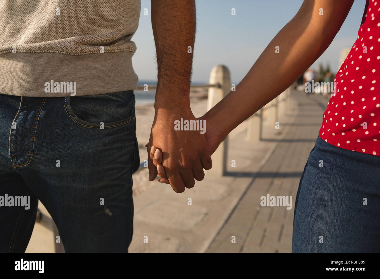 Couple standing at promenade Stock Photo - Alamy