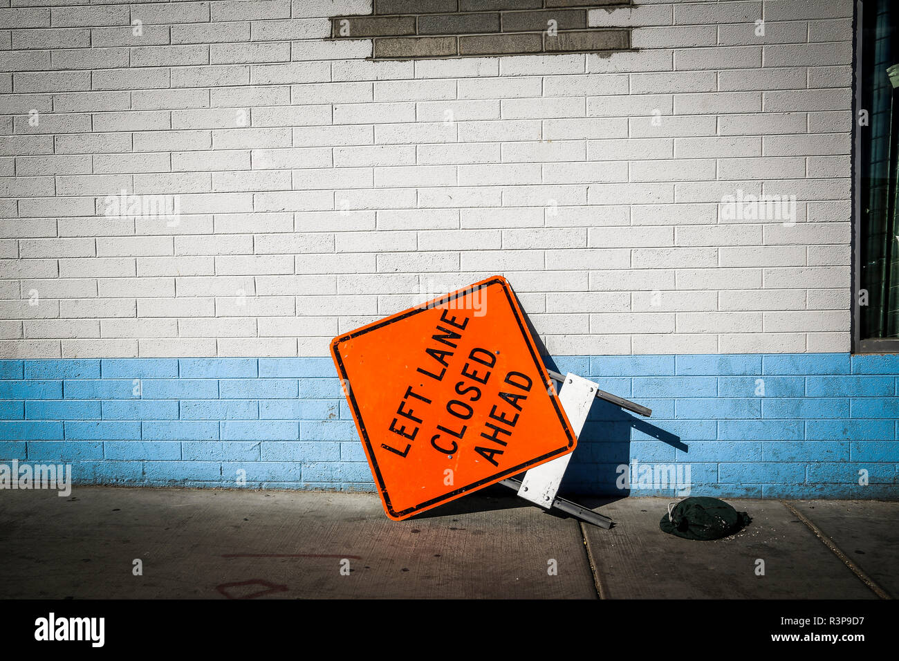 road sign in front of house wall Stock Photo - Alamy