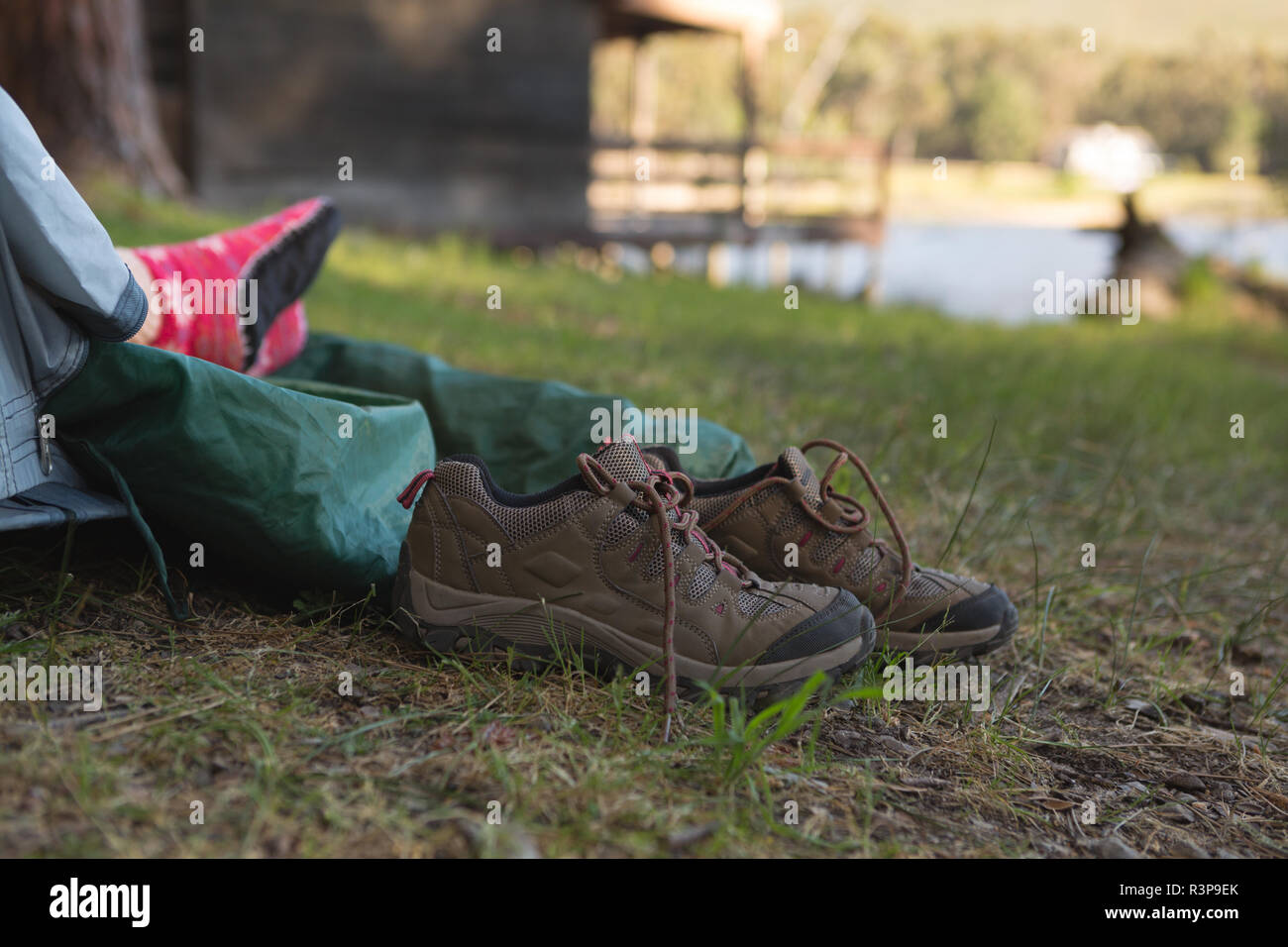 Shoes outside the tent at campsite Stock Photo - Alamy