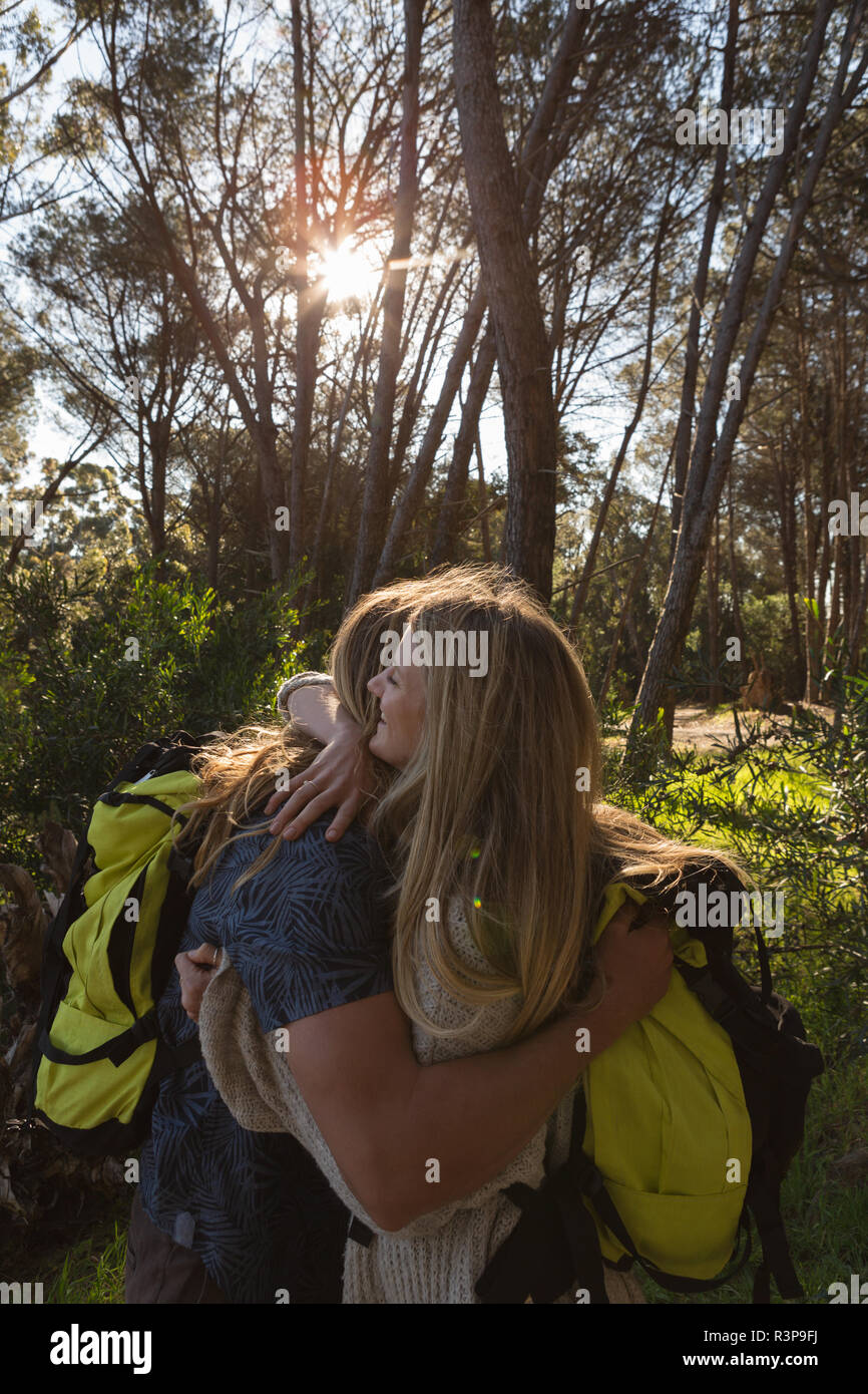 Couple hugging each other in the forest Stock Photo - Alamy