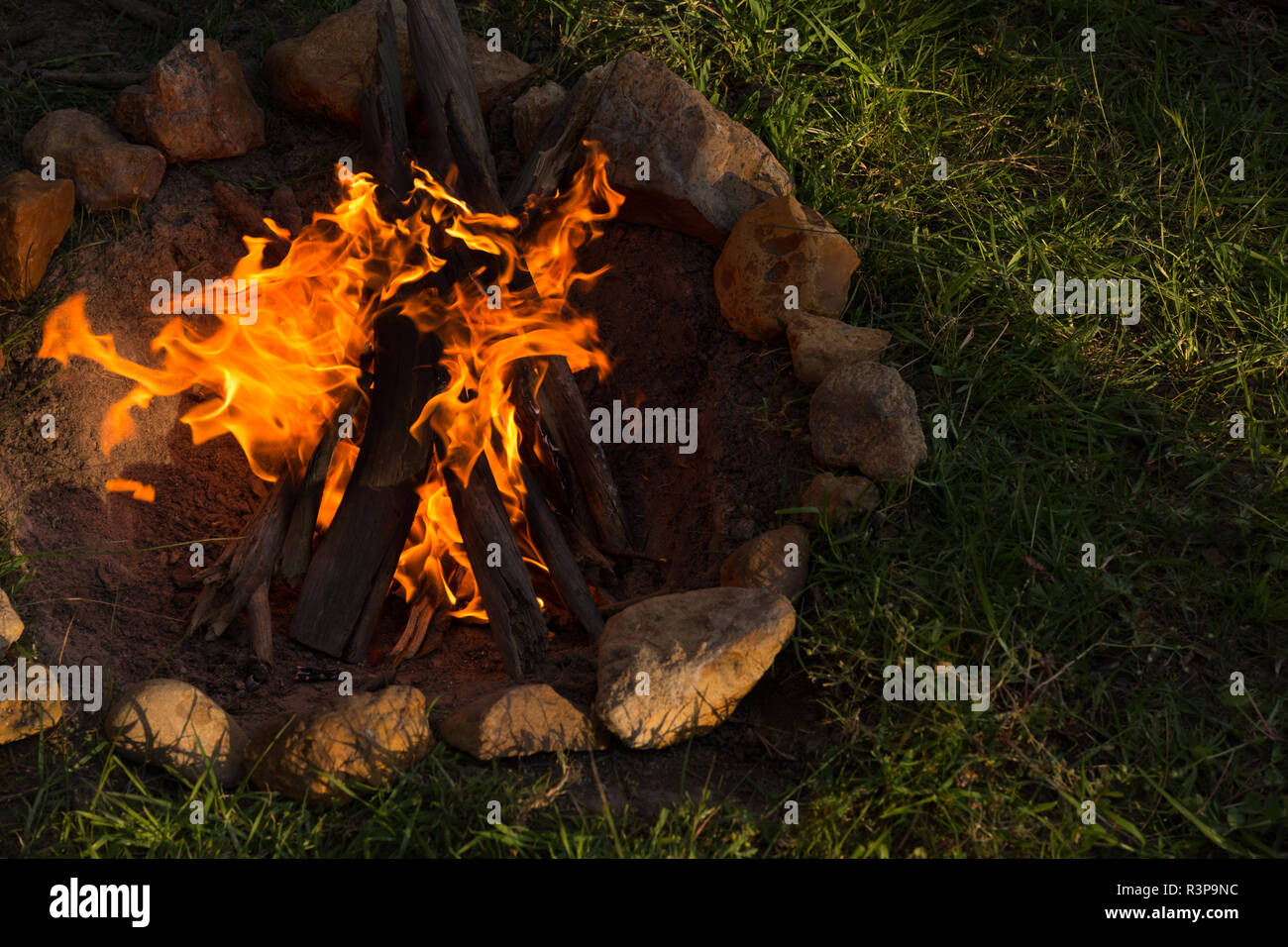 Bonfire at campsite Stock Photo - Alamy