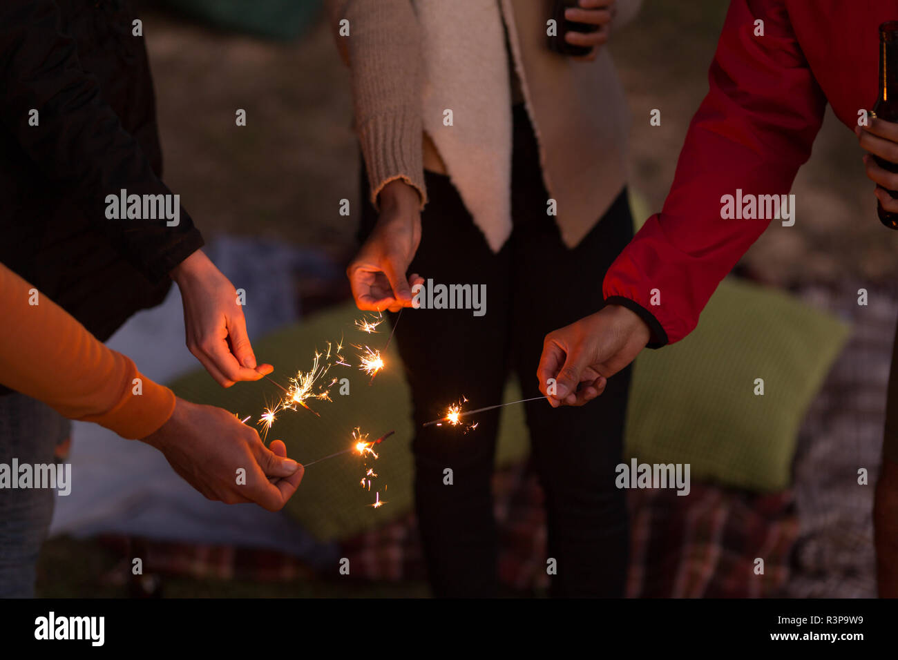 Woman playing sparklers hi-res stock photography and images - Alamy