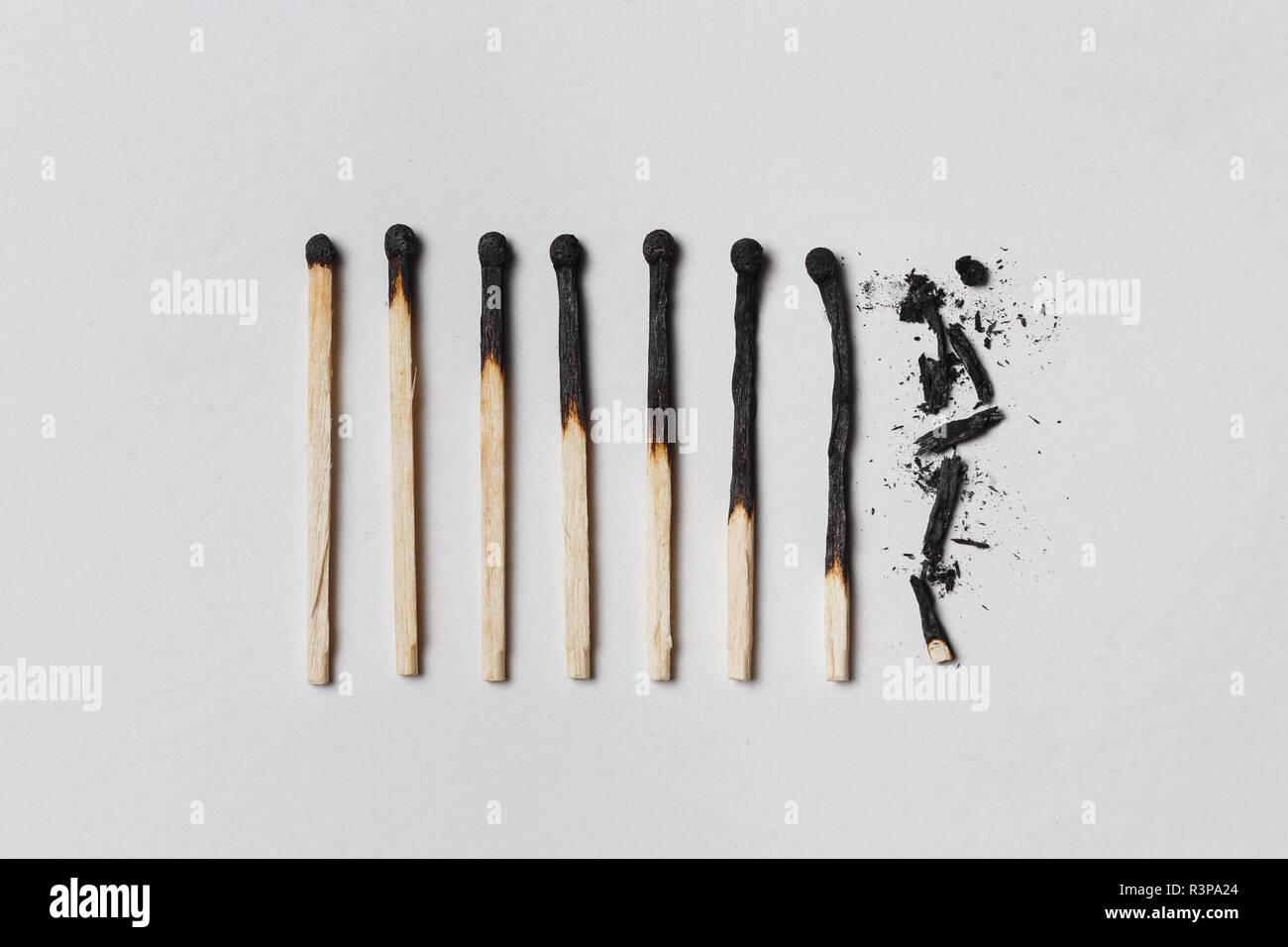 Concept of patience. A row of burnt matches, from left to right, from ...
