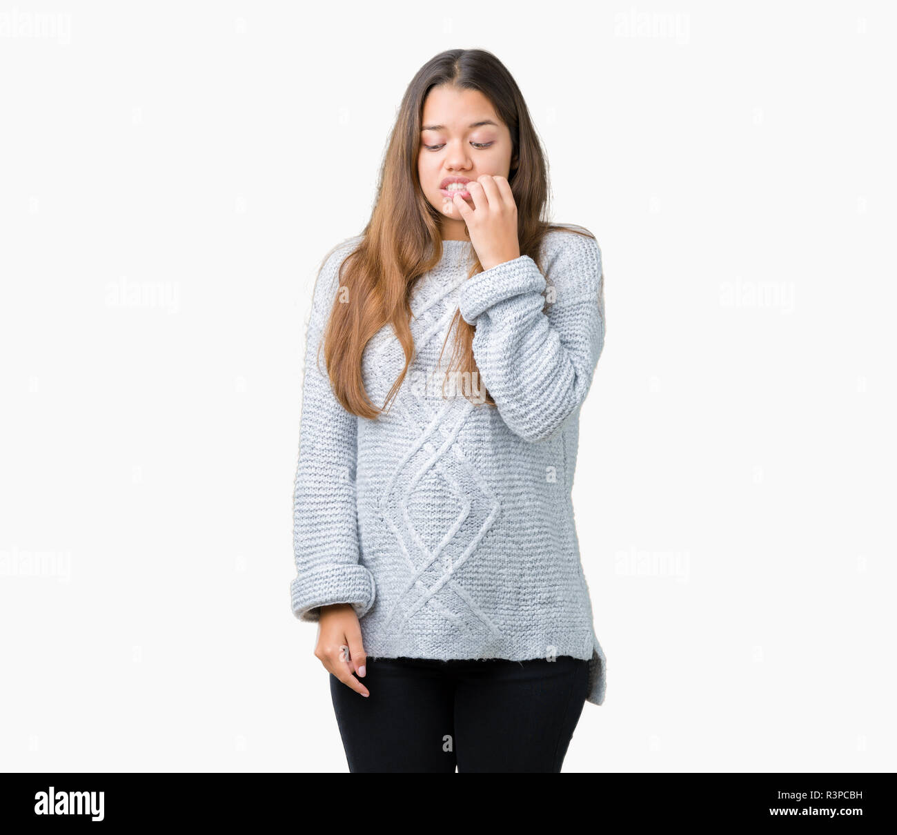 Young beautiful brunette woman wearing sweater over isolated background ...