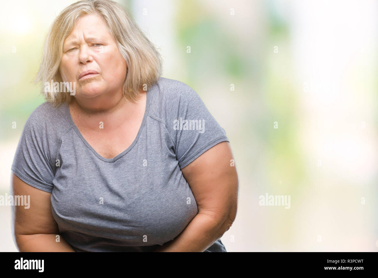Senior plus size caucasian woman over isolated background with hand on ...