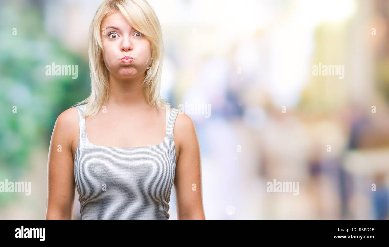 Young Beautiful Blonde Woman Over Isolated Background Puffing Cheeks With Funny Face Mouth
