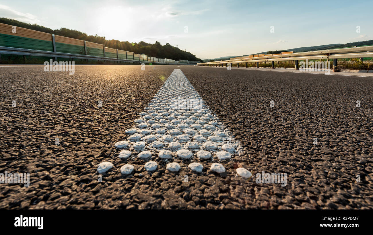 Empty Asphalt highway road with close up markings Stock Photo - Alamy