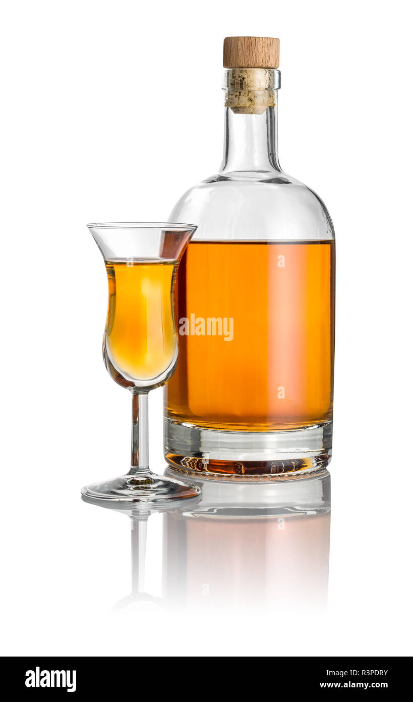 bottle and tall goblet filled with amber liquid Stock Photo - Alamy