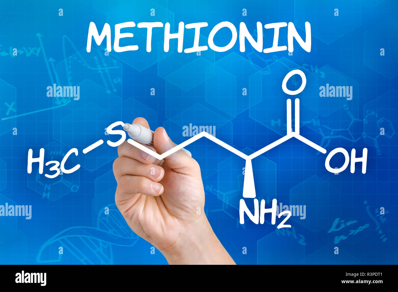hand with pen draws chemical structural formula of methionine Stock ...