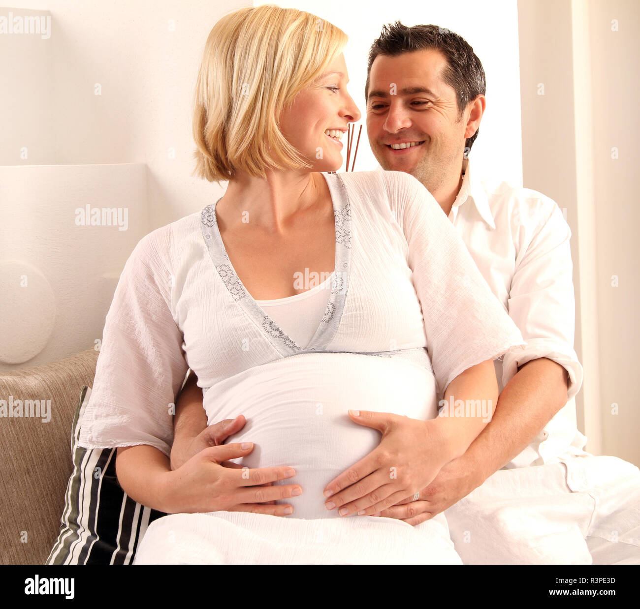 happy pregnant couple Stock Photo - Alamy