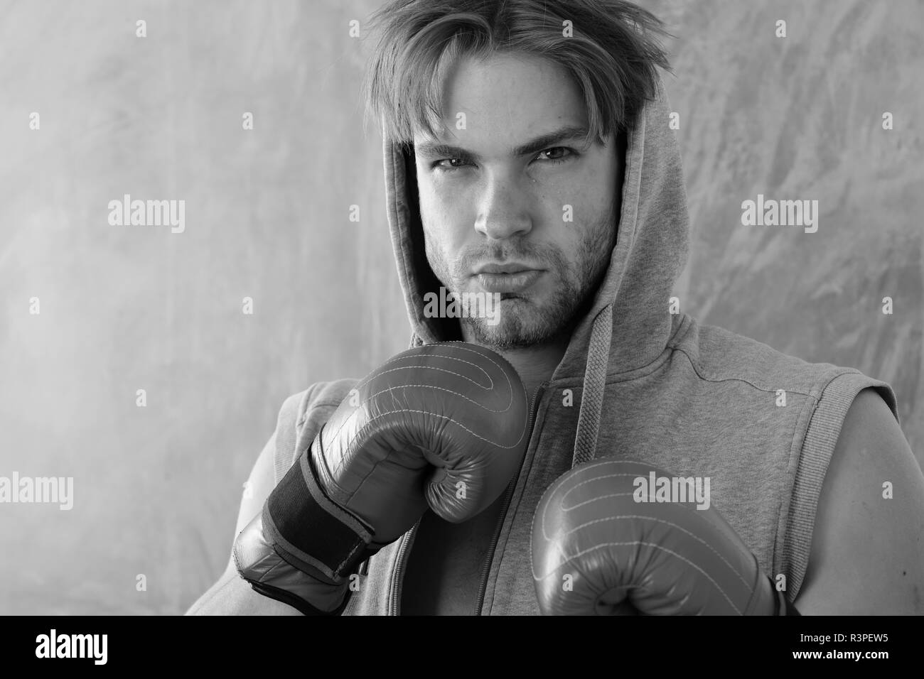 Sports and fight concept. Man with messy hair on orange texture ...