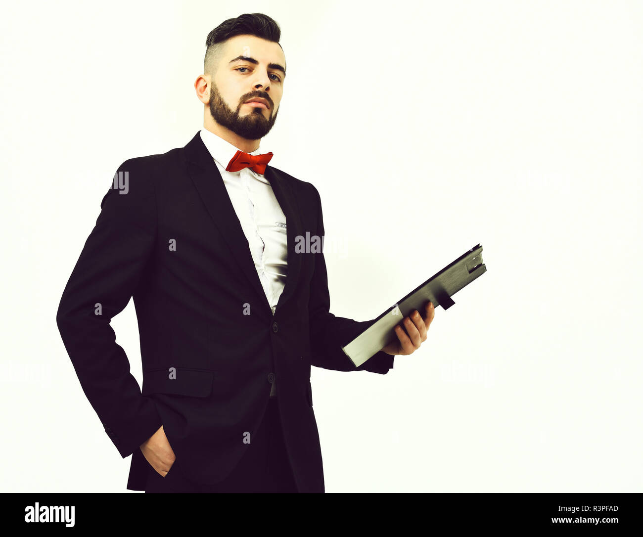 Manager in black suit and red bow tie with confident face expression ...