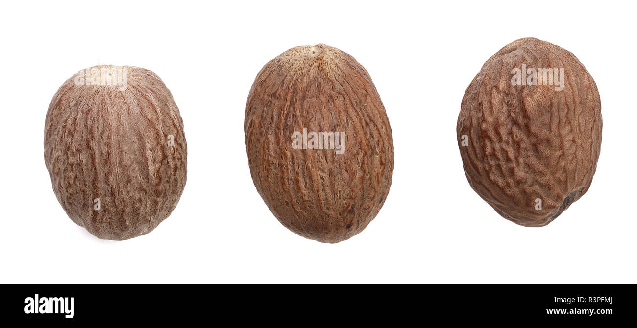 Three nutmeg whole isolated on white background. Top view Stock Photo ...