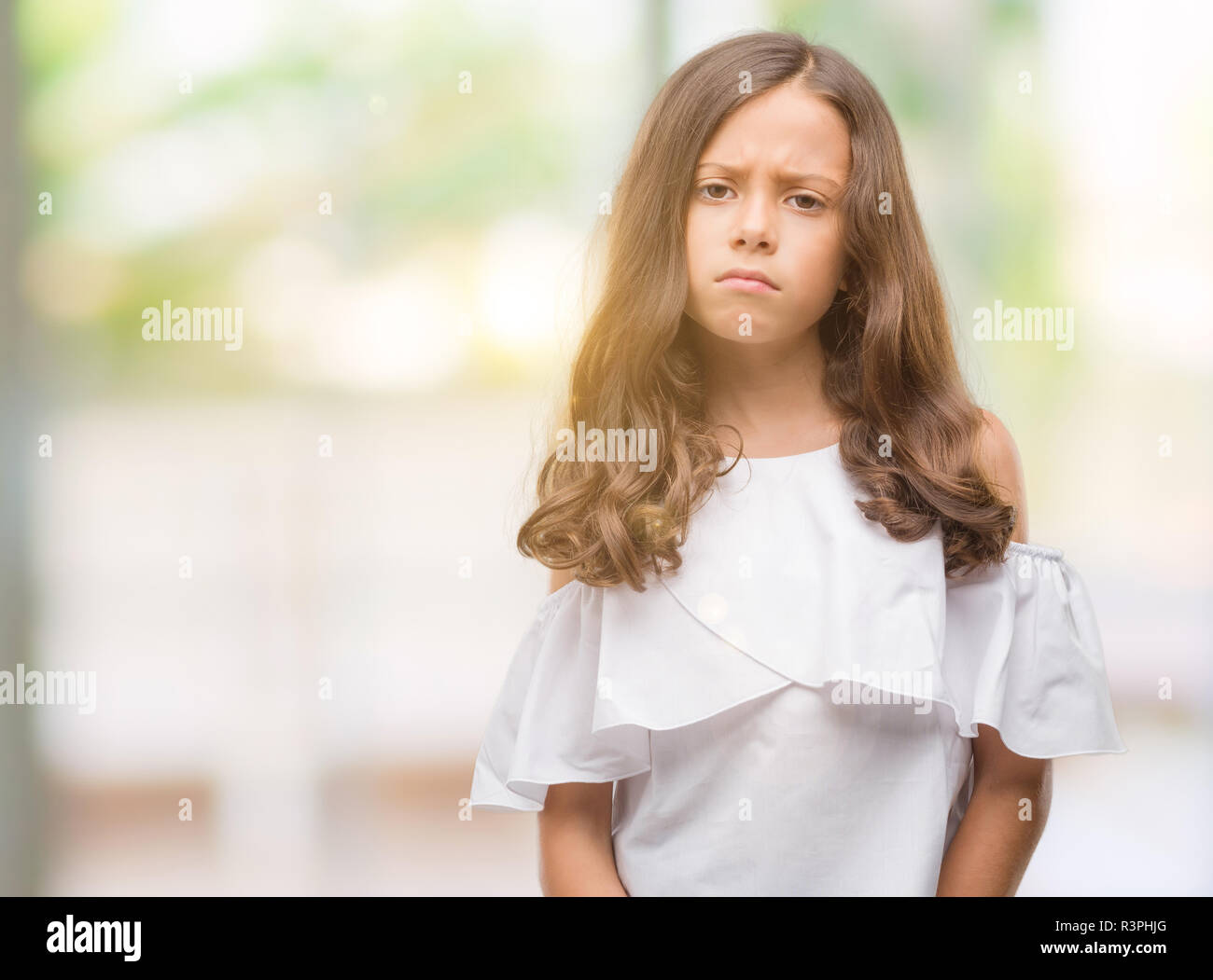 Brunette hispanic girl skeptic and nervous, frowning upset because of ...