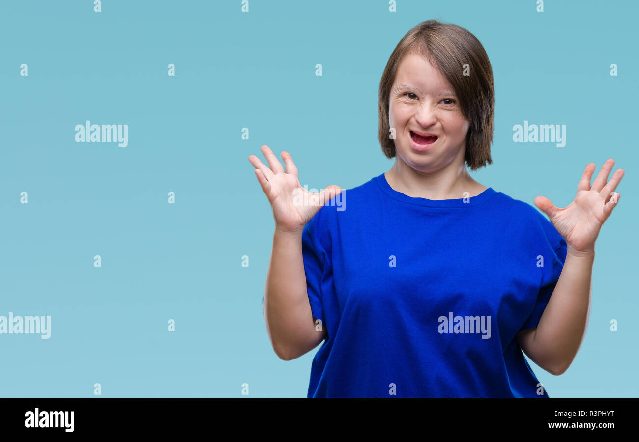Young adult woman with down syndrome over isolated background ...