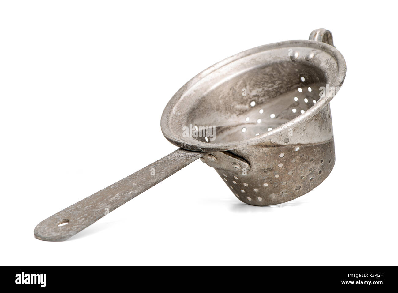 Old metal colander on white background Stock Photo - Alamy