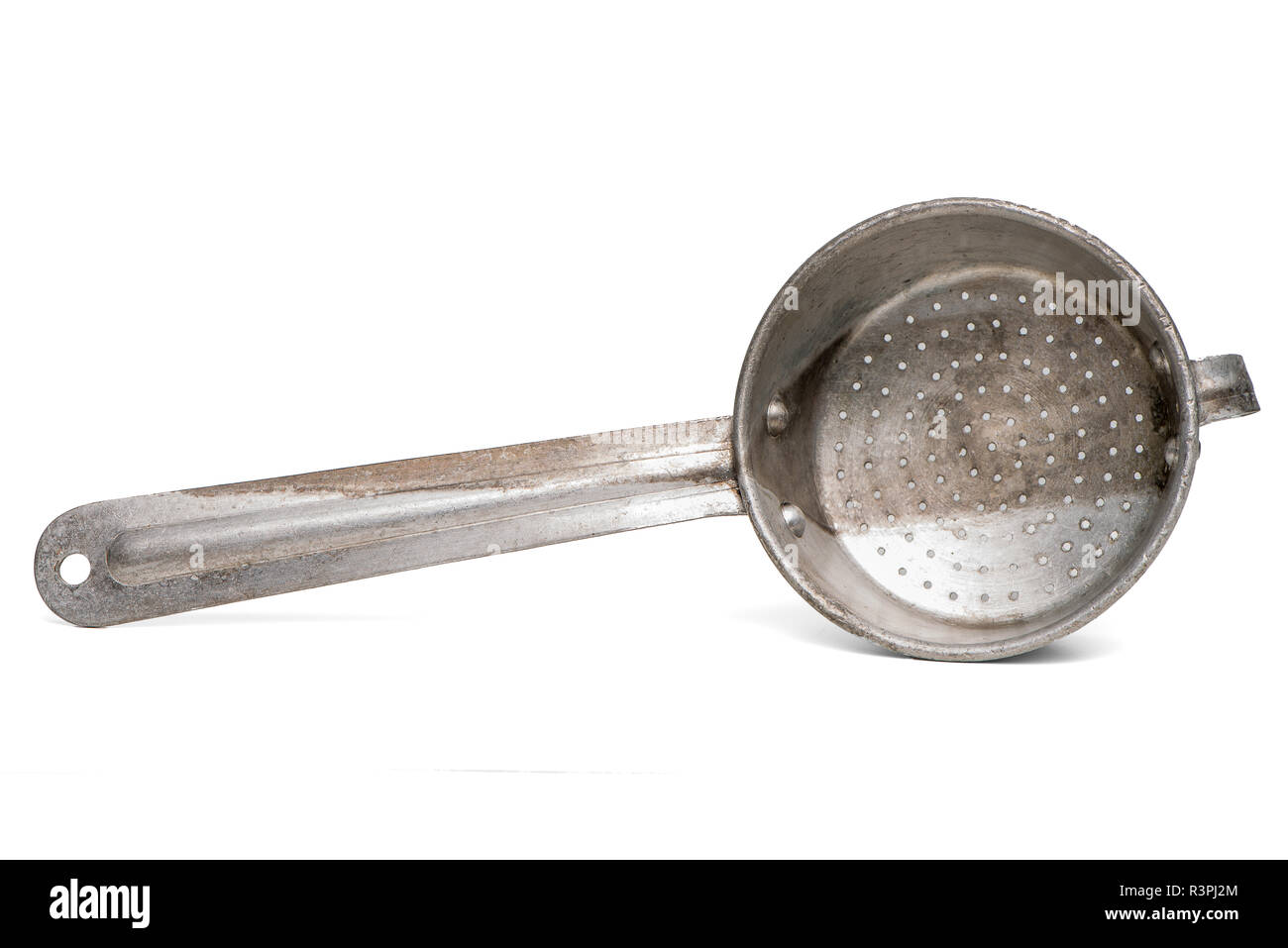 Old metal colander on white background Stock Photo - Alamy