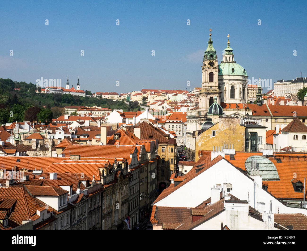 Czech Republic, Prague. Prague rooftops and St. Nicholas Cathedral as ...