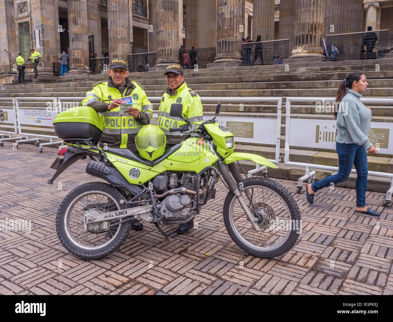 Bogota, Colombia - September 13, 2013: A policemen with motor in yellow ...