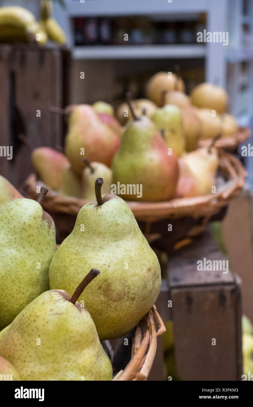 Variety of pears on sale in baskets at Eataly high-end food market in ...