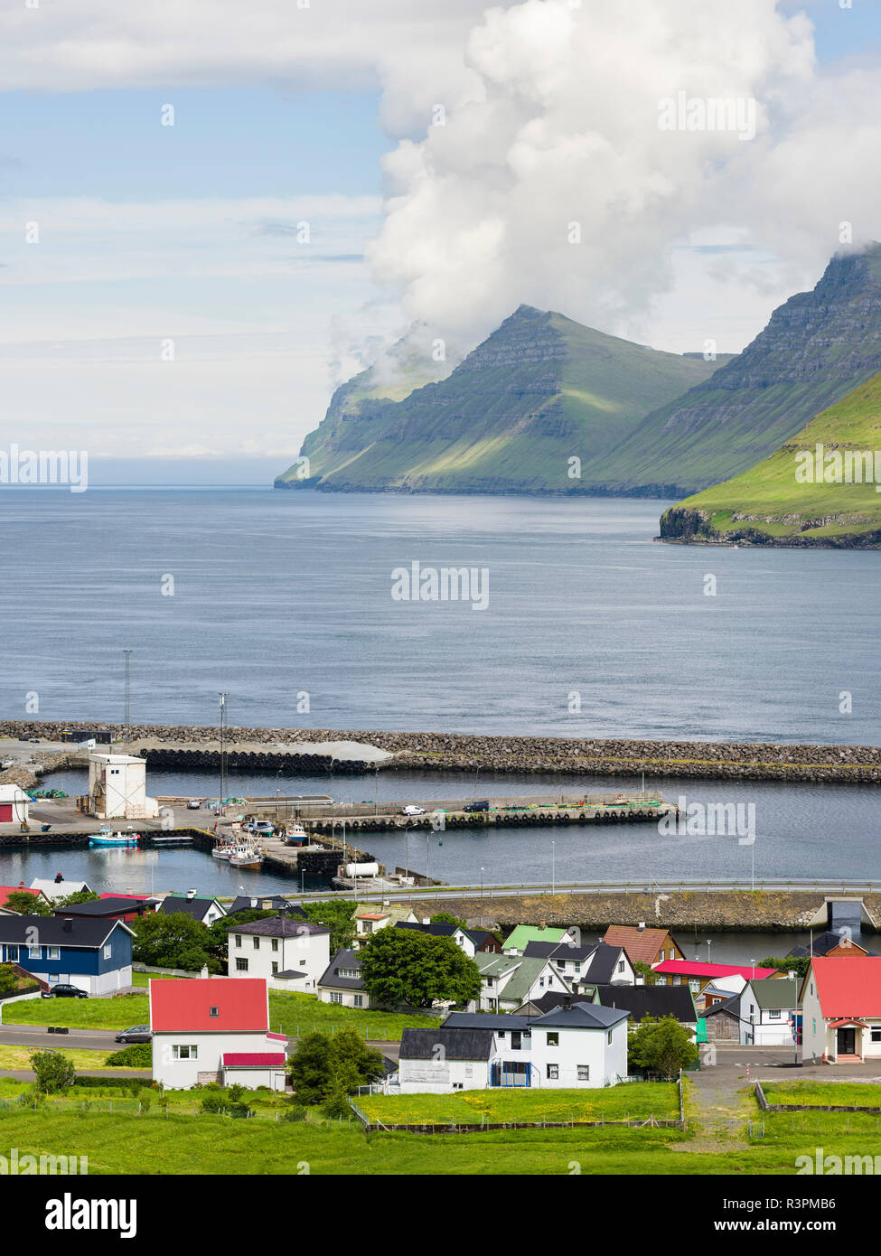 Small town Leirvik located at Leiriksfjordur. Mountains of the island ...