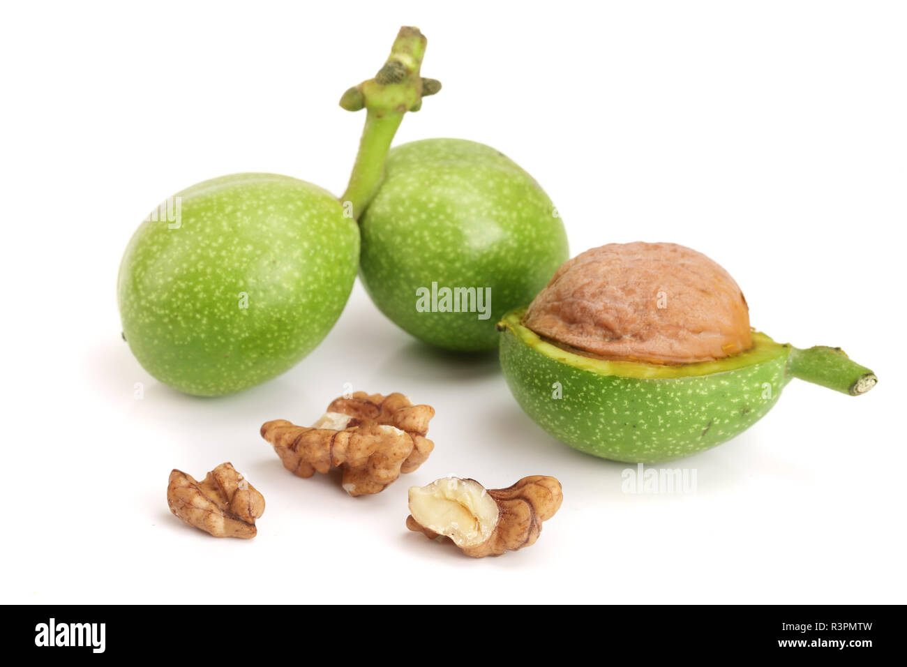 fresh walnuts in peel isolated on white background Stock Photo - Alamy