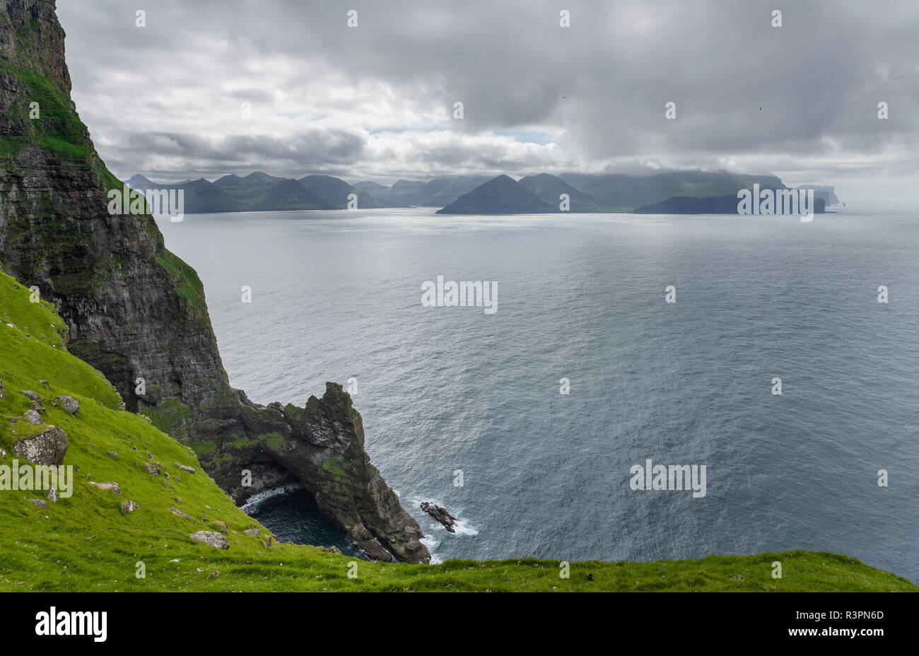 Island Kalsoy, the cliffs of Kallur. In the background the island ...