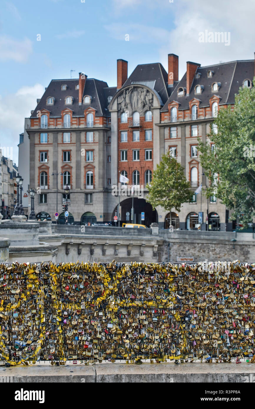 Love locks on bridge railing along the Seine River, Paris, France Stock ...