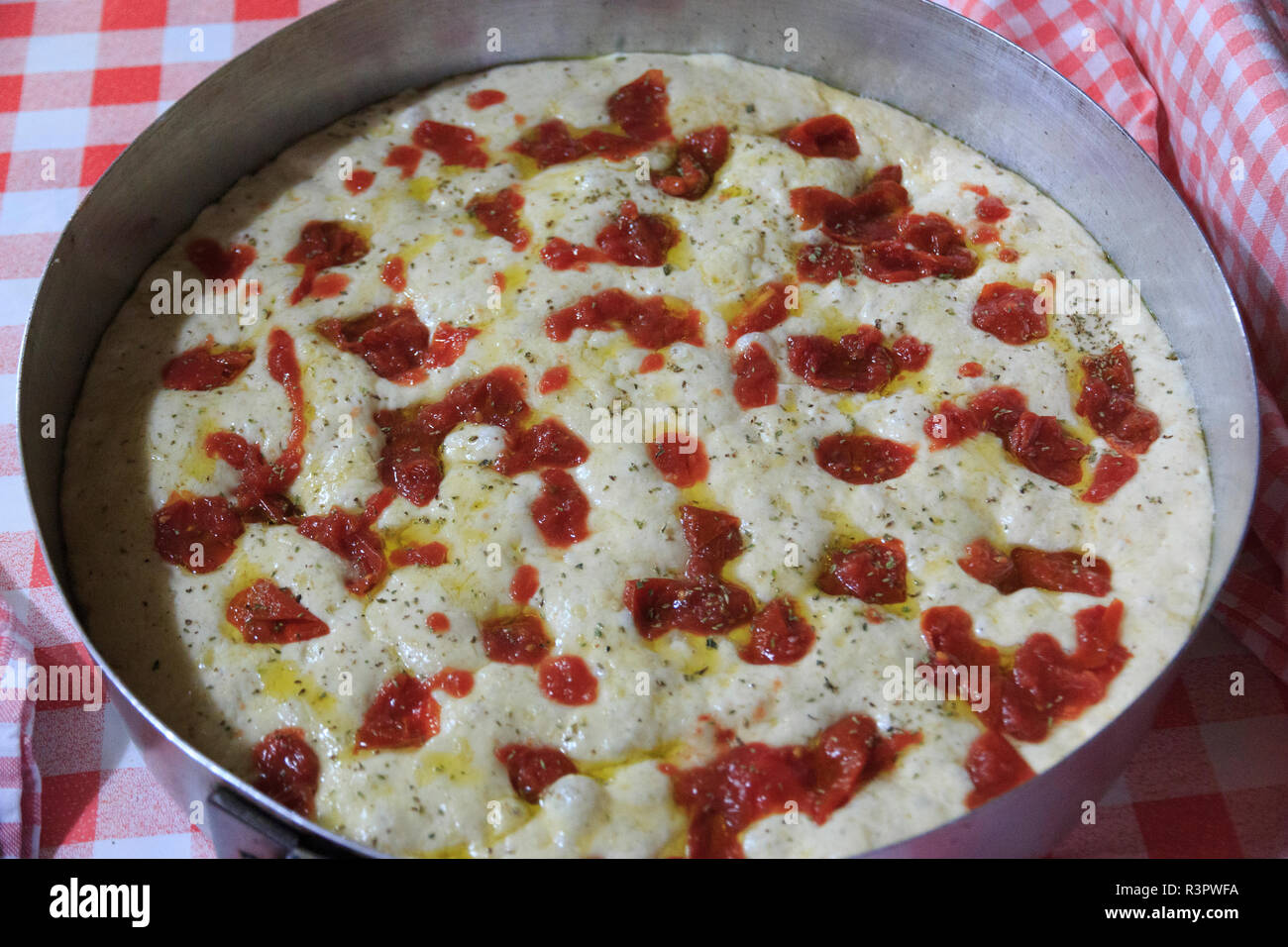 Italy, Puglia. Making Focaccia, a flat oven-baked Italian bread product ...
