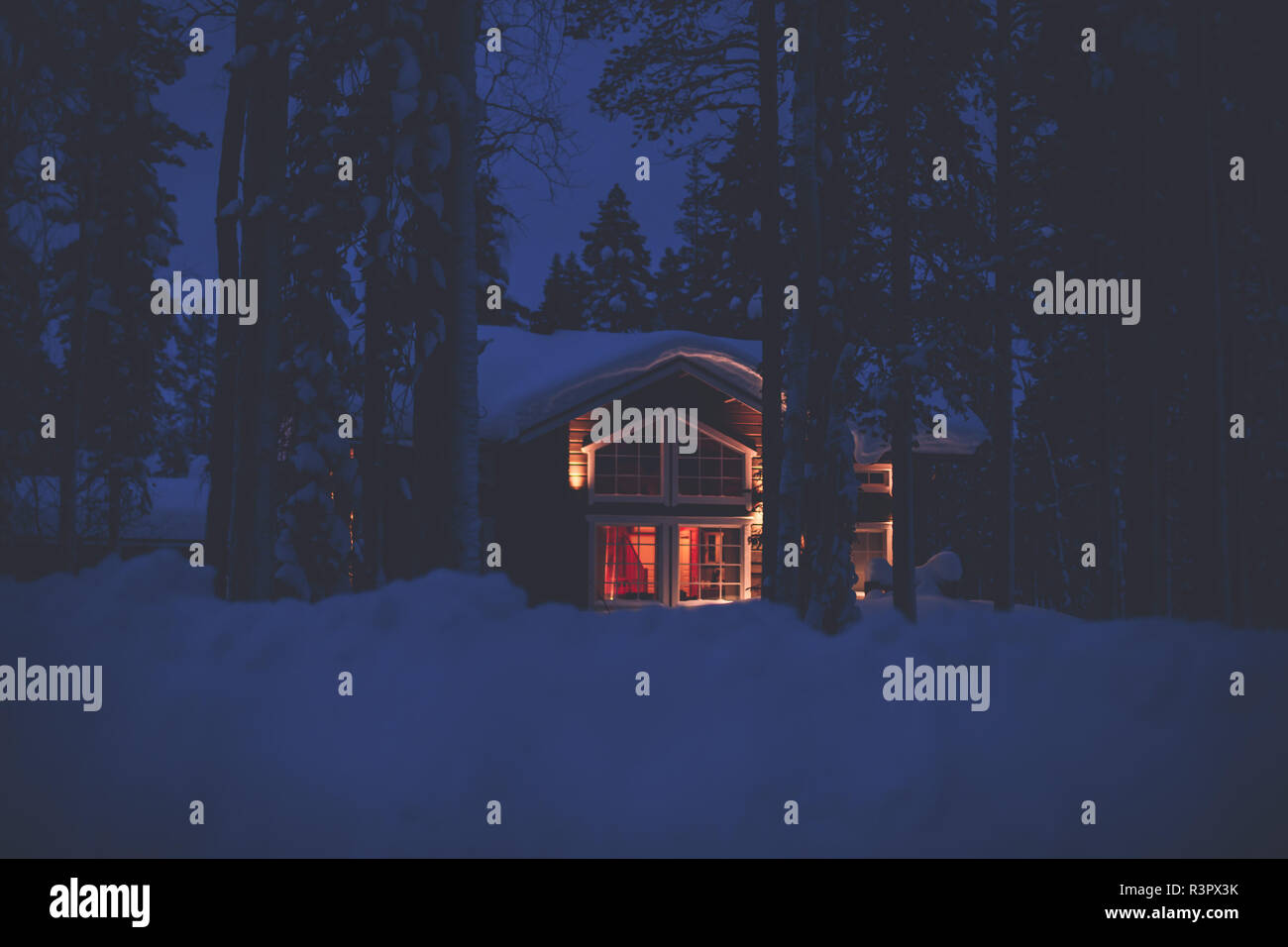 A night view of cozy wooden scandinavian cabin cottage chalet house ...