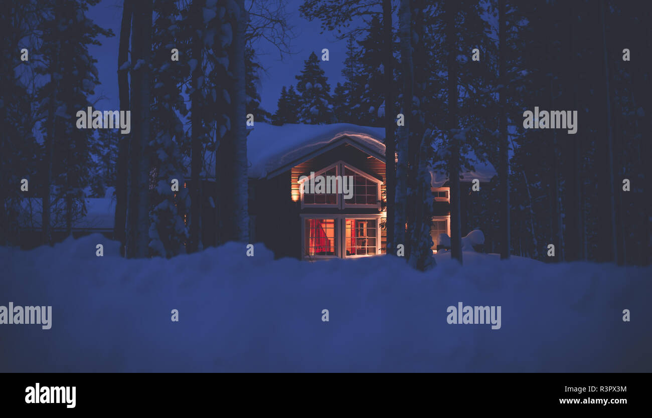 A night view of cozy wooden scandinavian cabin cottage chalet house ...